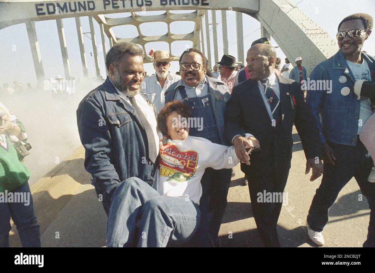 Sheyane Webb is carried off the Edmund Pettus Bridge in Selma, March 4 ...