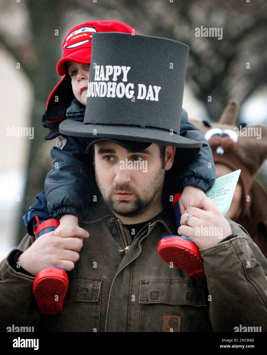 Paul Porter, from Parkersburg, W.Va. gives his three-year-old son ...