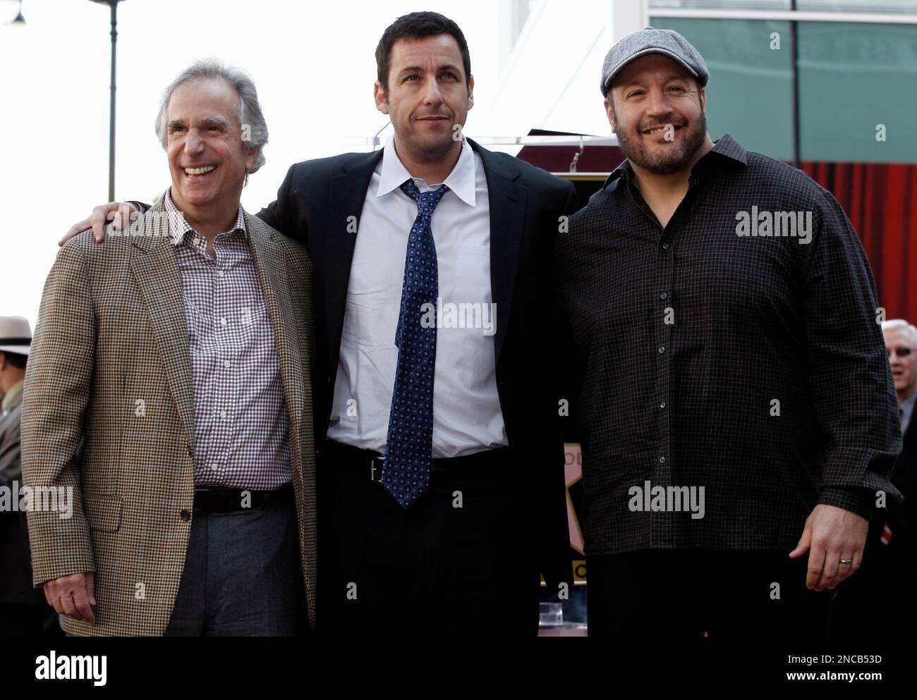 Actors Adam Sandler, center, Kevin James, right, and Henry Winkler pose ...
