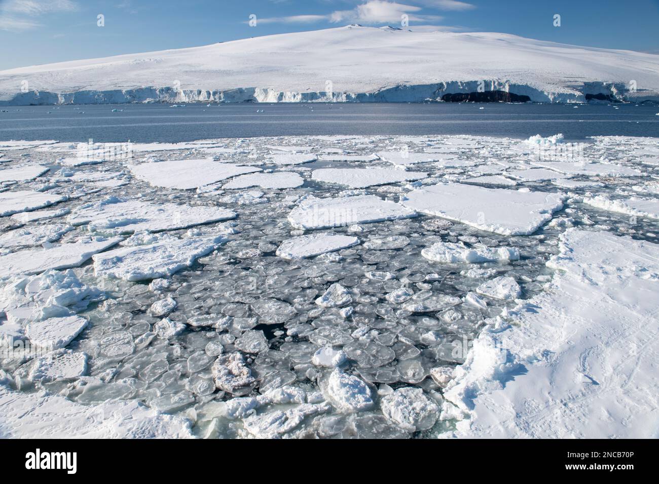 Antarctica, Ross Sea, Ross Island. Mix of icebergs and pancake ice off ...