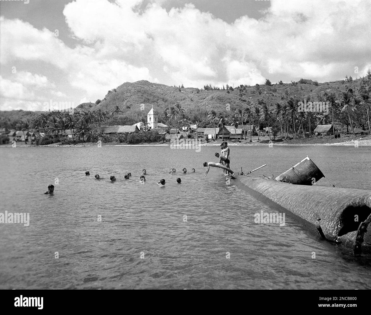 Swimming from an old Japanese midget sub near the village is one of ...