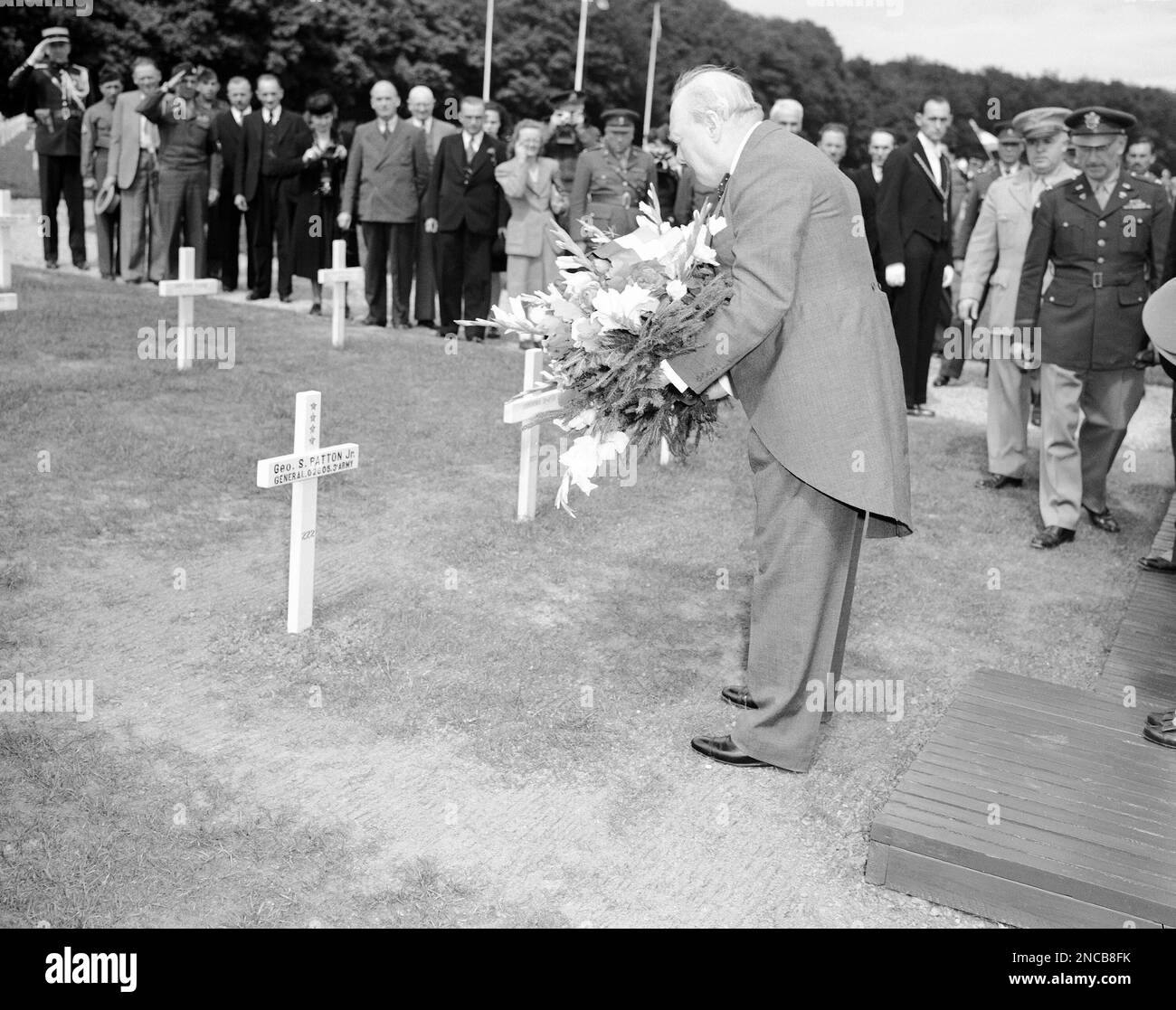 Winston Churchill, wartime leader of Britain, places flowers on the ...