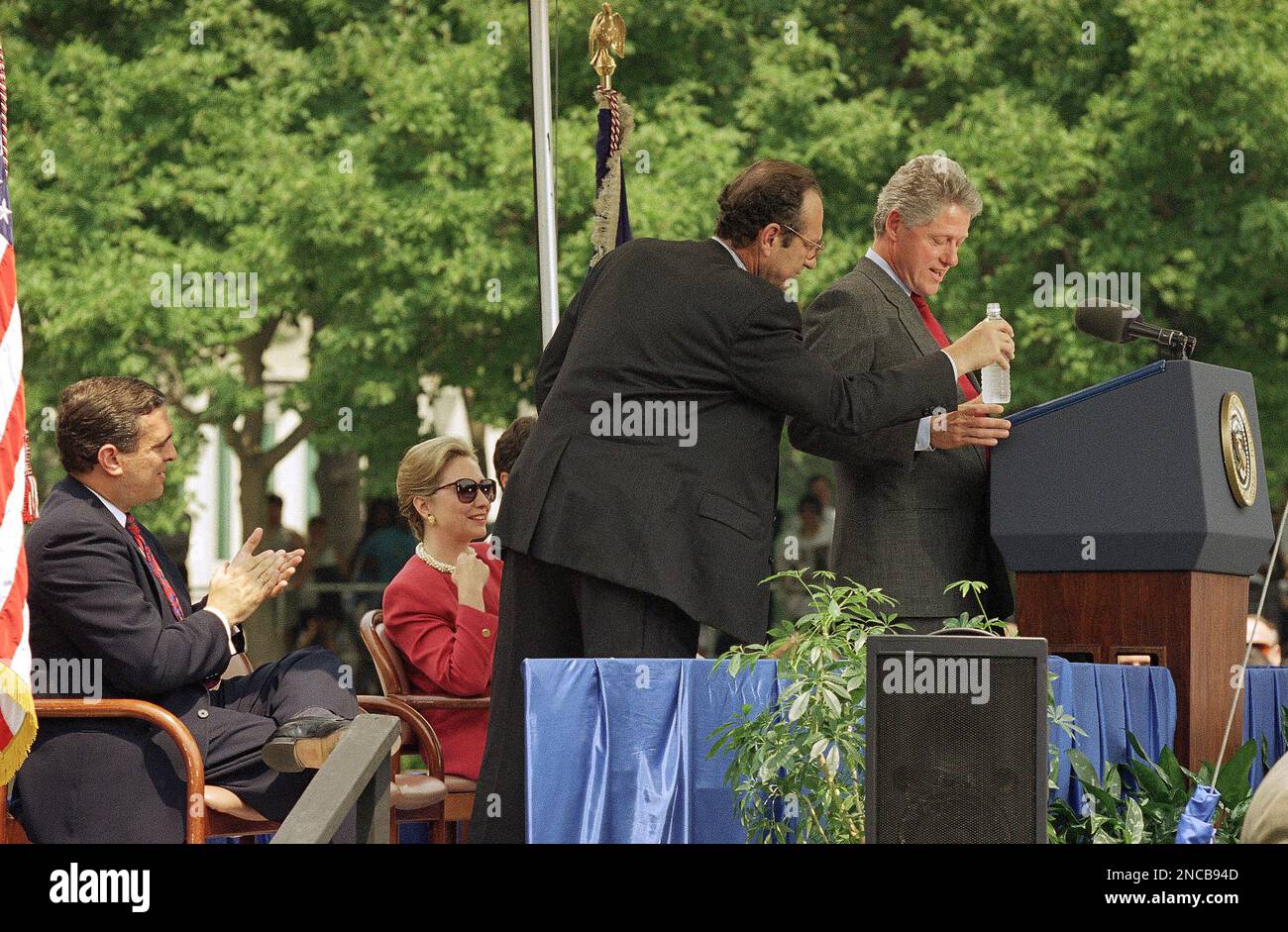CIA Director John Deutch gives U.S. President Bill Clinton a bottle of ...