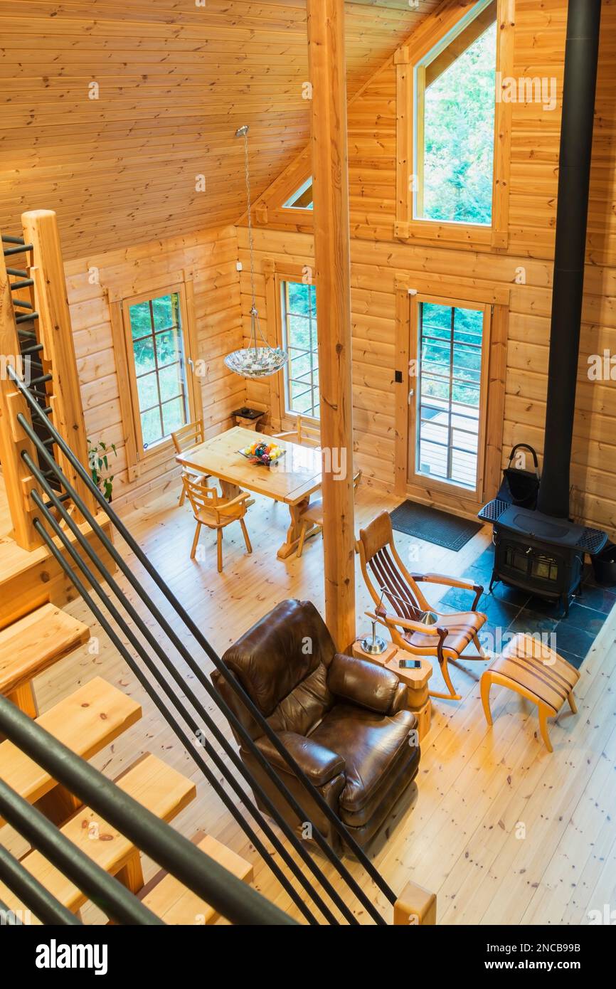Looking down at living room with brown leather reclining armchair ...