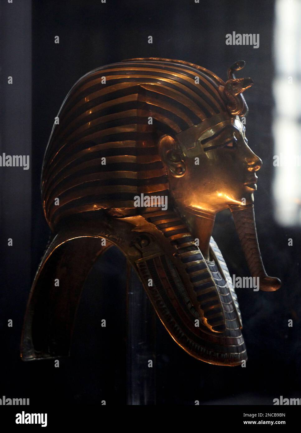 The funeral mask of King Tutankhamun is seen behind a locked gate in ...