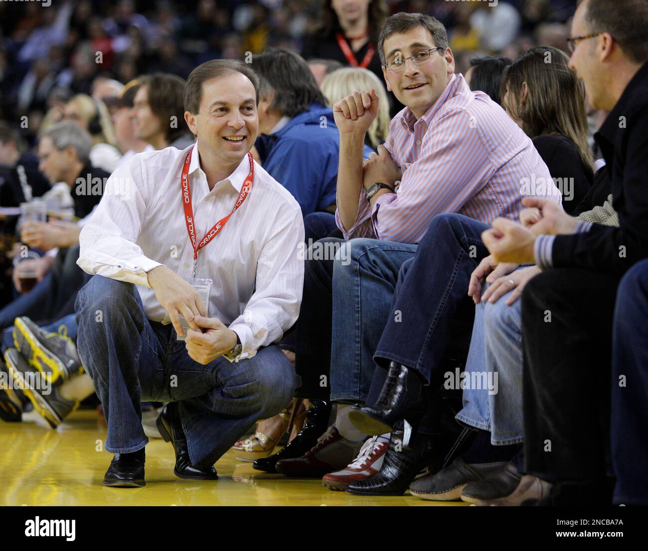 Golden State Warriors co-owner Joe Lacob, left, chats with fans during ...