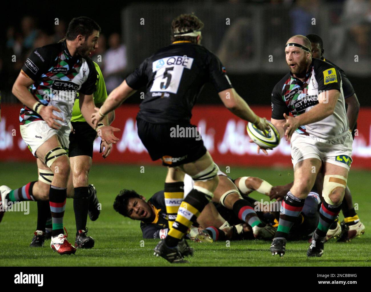 Ceri Jones from Harlequins, right, passes the ball during a rugby match ...