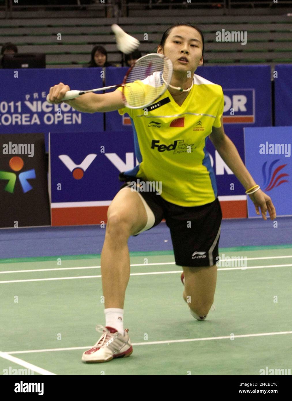 China's Wang Yihan returns a shout in women's singles final match ...