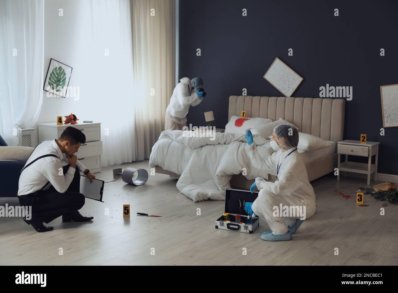 Investigators working at crime scene in messy room Stock Photo - Alamy
