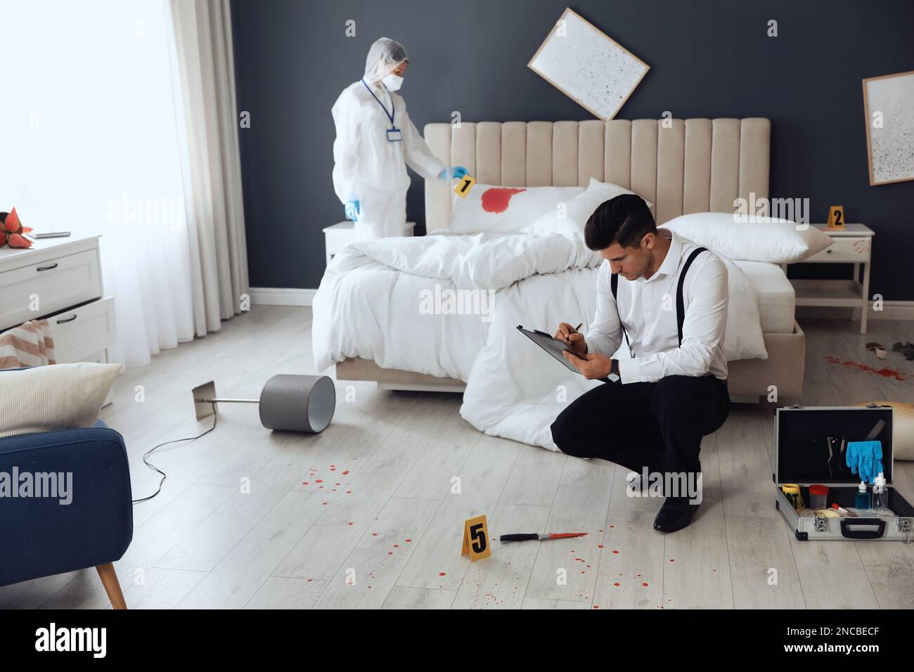 Investigators working at crime scene in messy room Stock Photo - Alamy