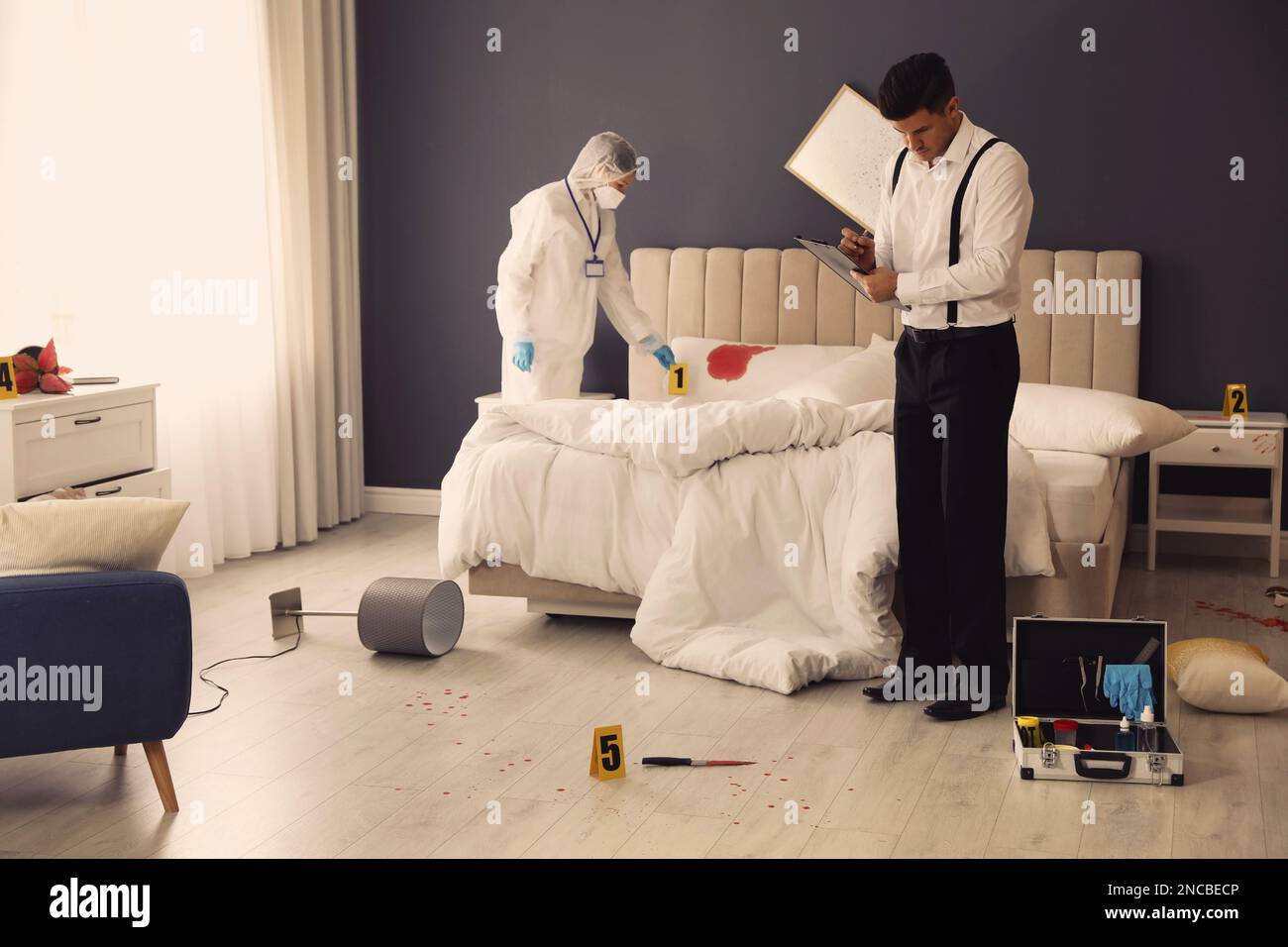 Investigators working at crime scene in messy room Stock Photo - Alamy