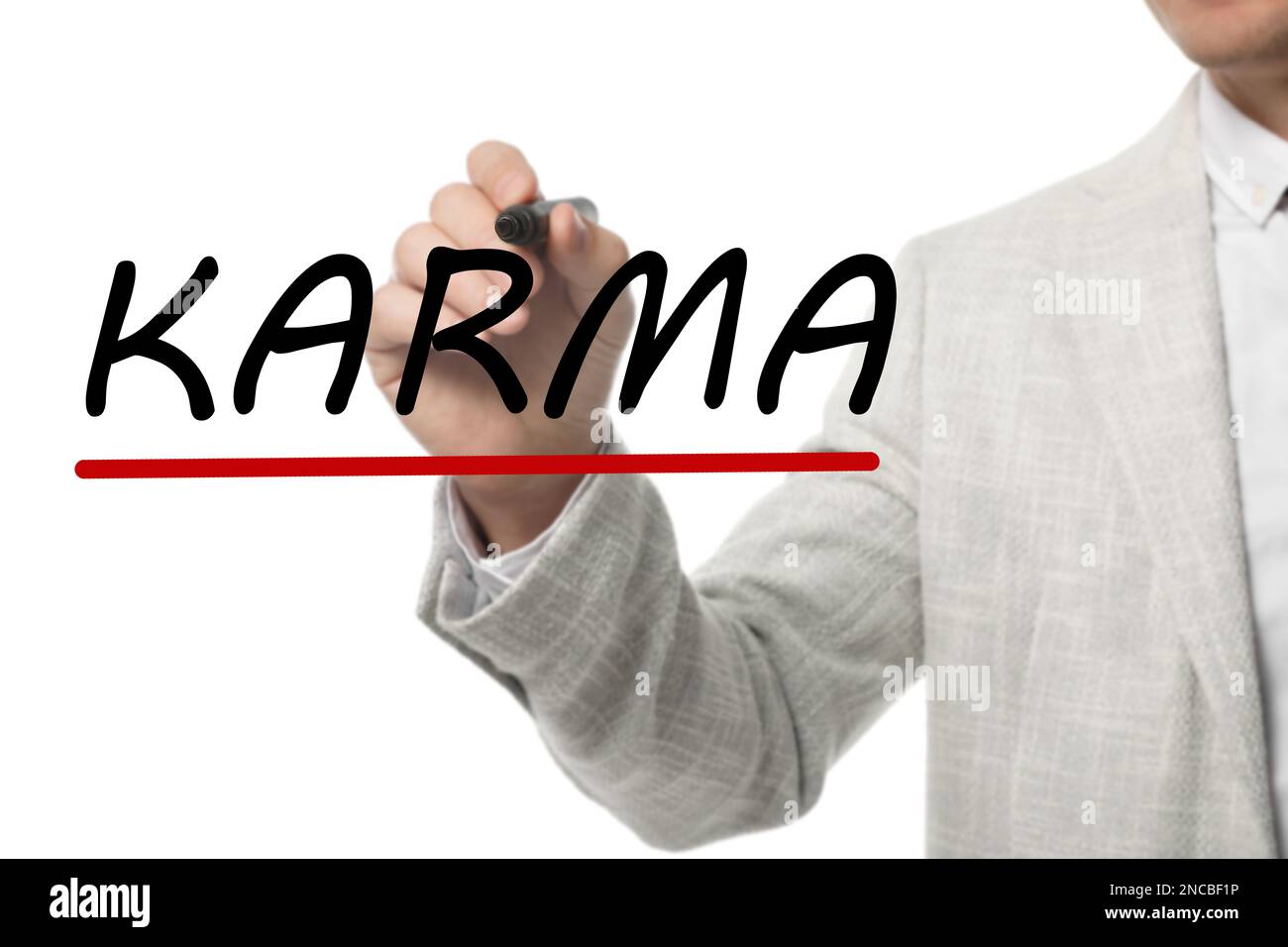 Man writing word KARMA on glass against white background, closeup Stock ...