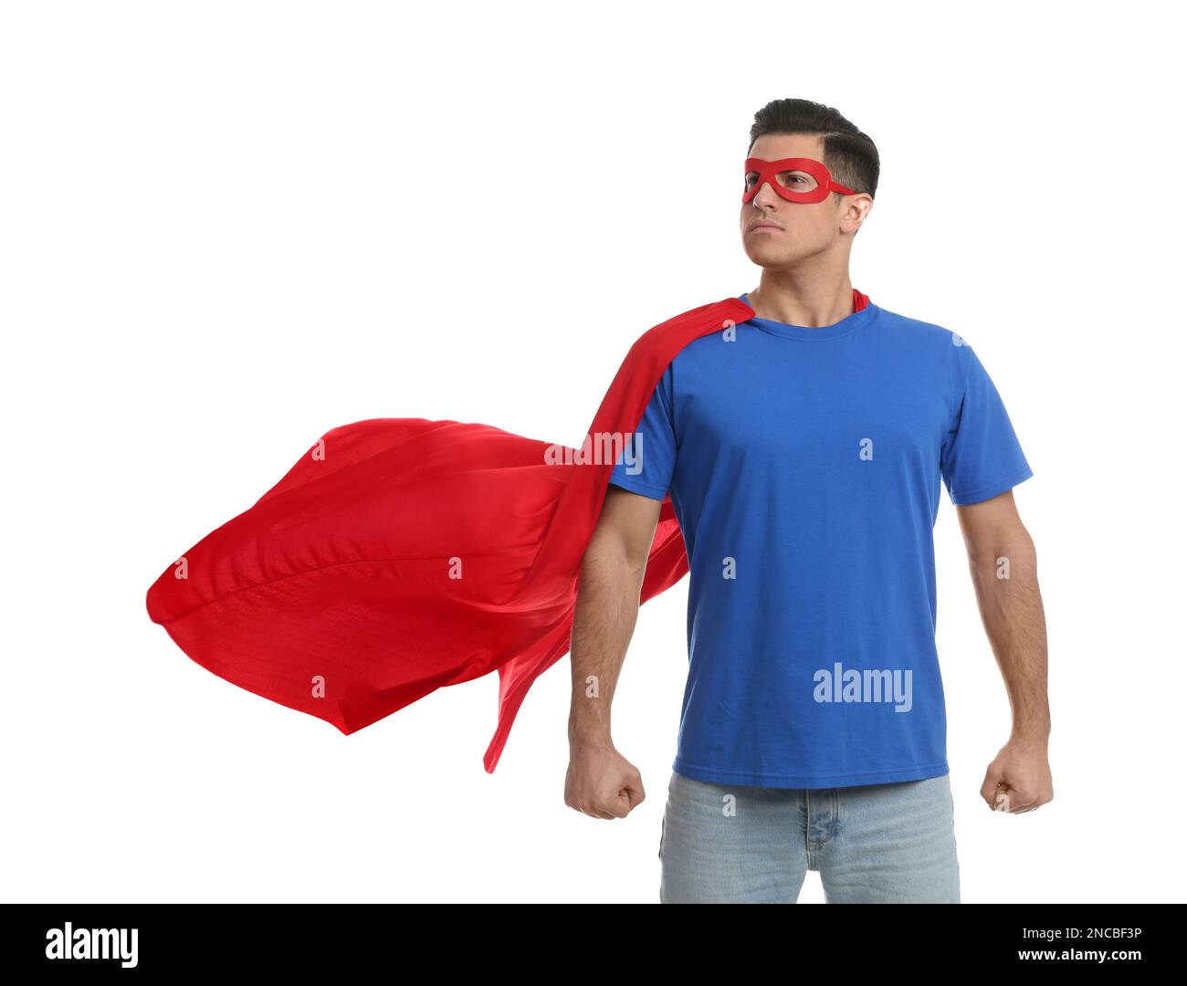 Man wearing superhero cape and mask on white background Stock Photo - Alamy
