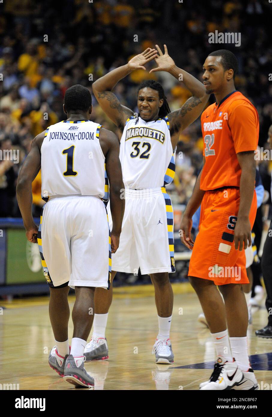 Marquette's Darius Johnson-Odom (1) celebrates with Jae Crowder (32) as ...