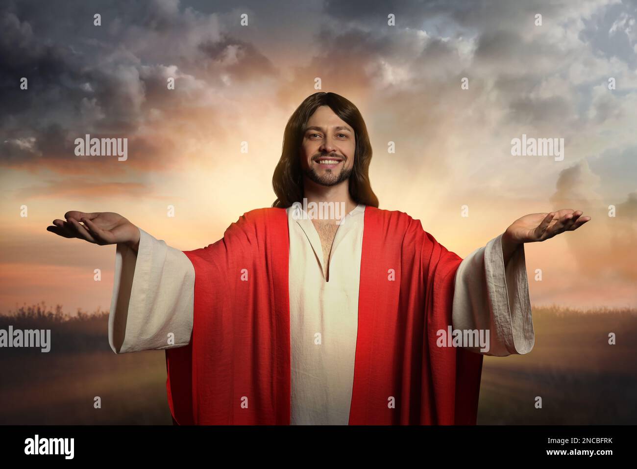 Jesus Christ with outstretched arms outdoors Stock Photo - Alamy