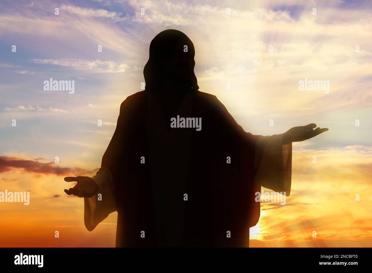 Silhouette of Jesus Christ outdoors at sunset Stock Photo - Alamy