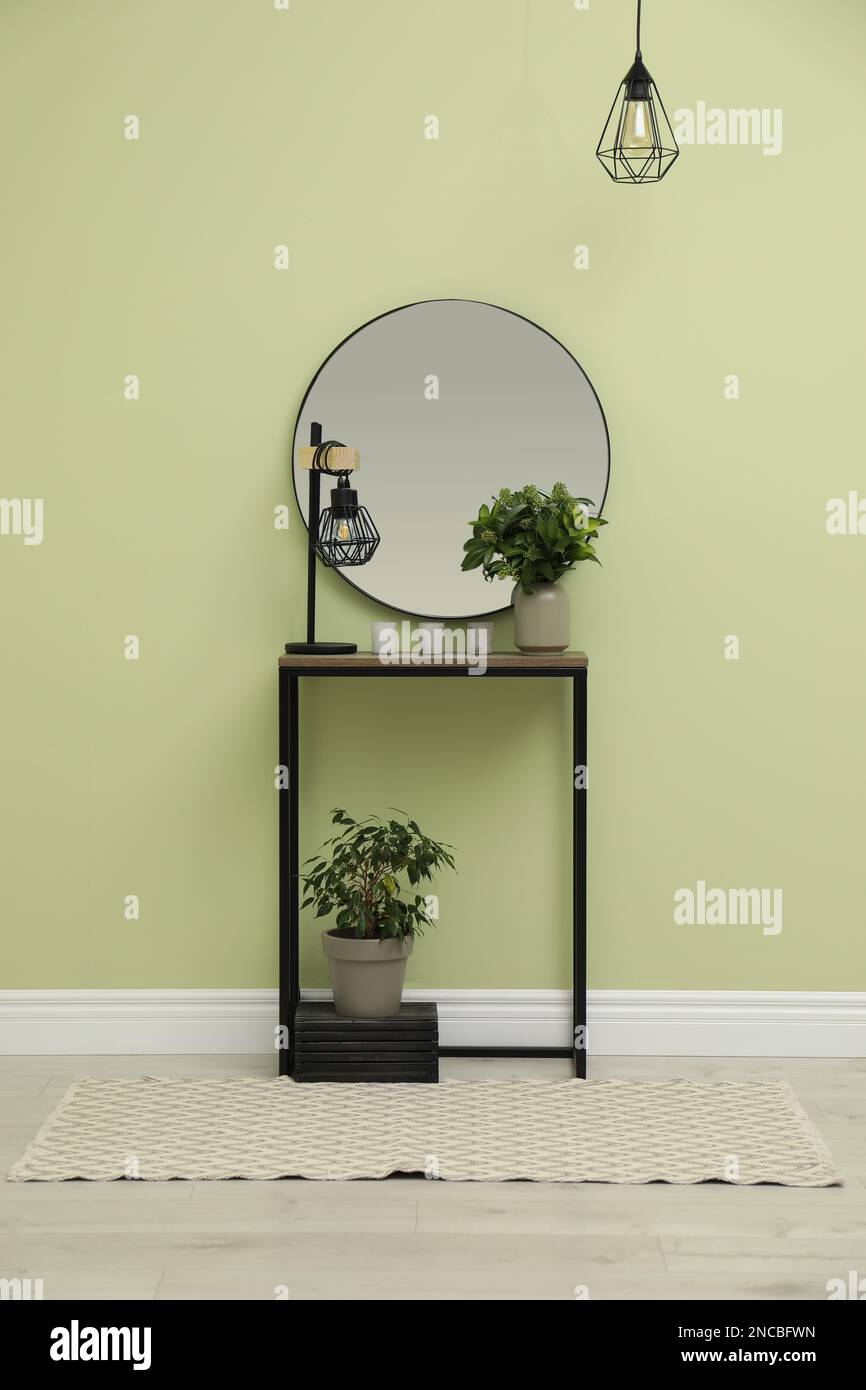 Hallway with stylish console table and mirror. Interior design Stock ...