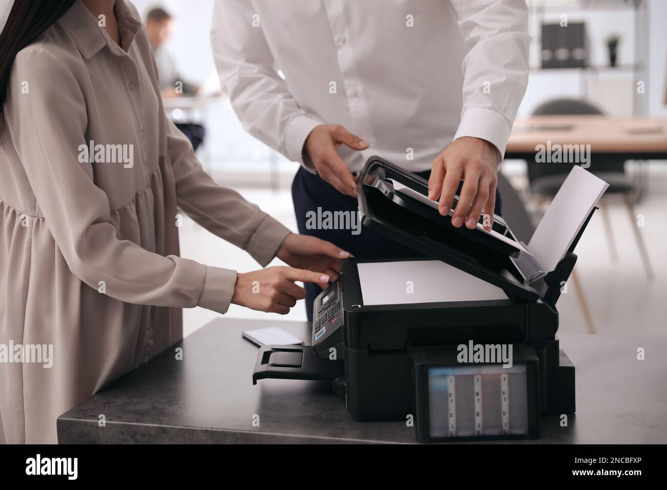 Employees using modern printer in office, closeup Stock Photo - Alamy