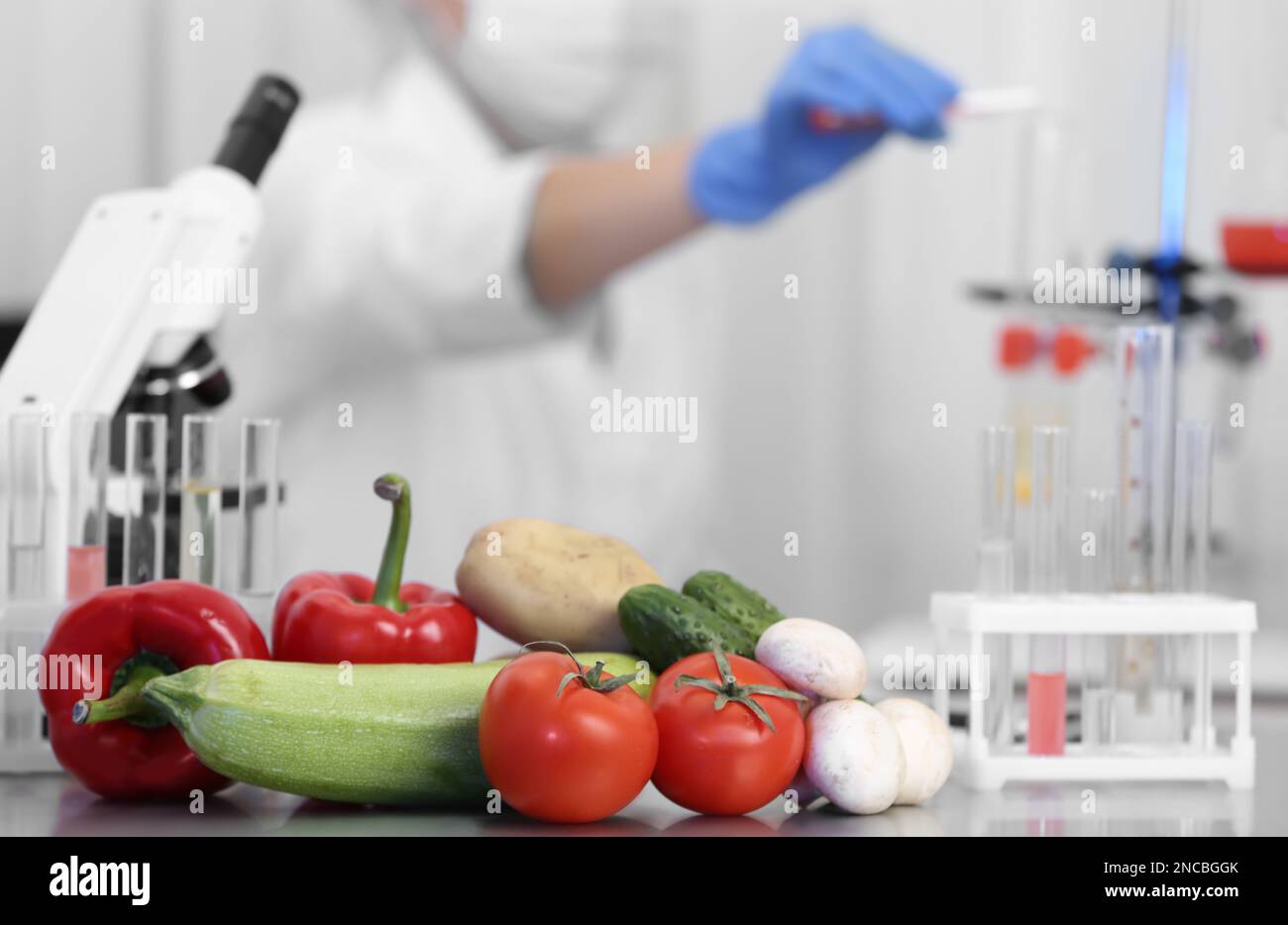 Fresh vegetables on table in laboratory. Food quality control Stock ...