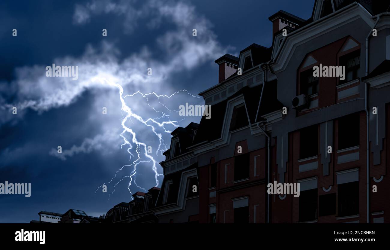 Dark cloudy sky with lightning over building. Stormy weather Stock ...