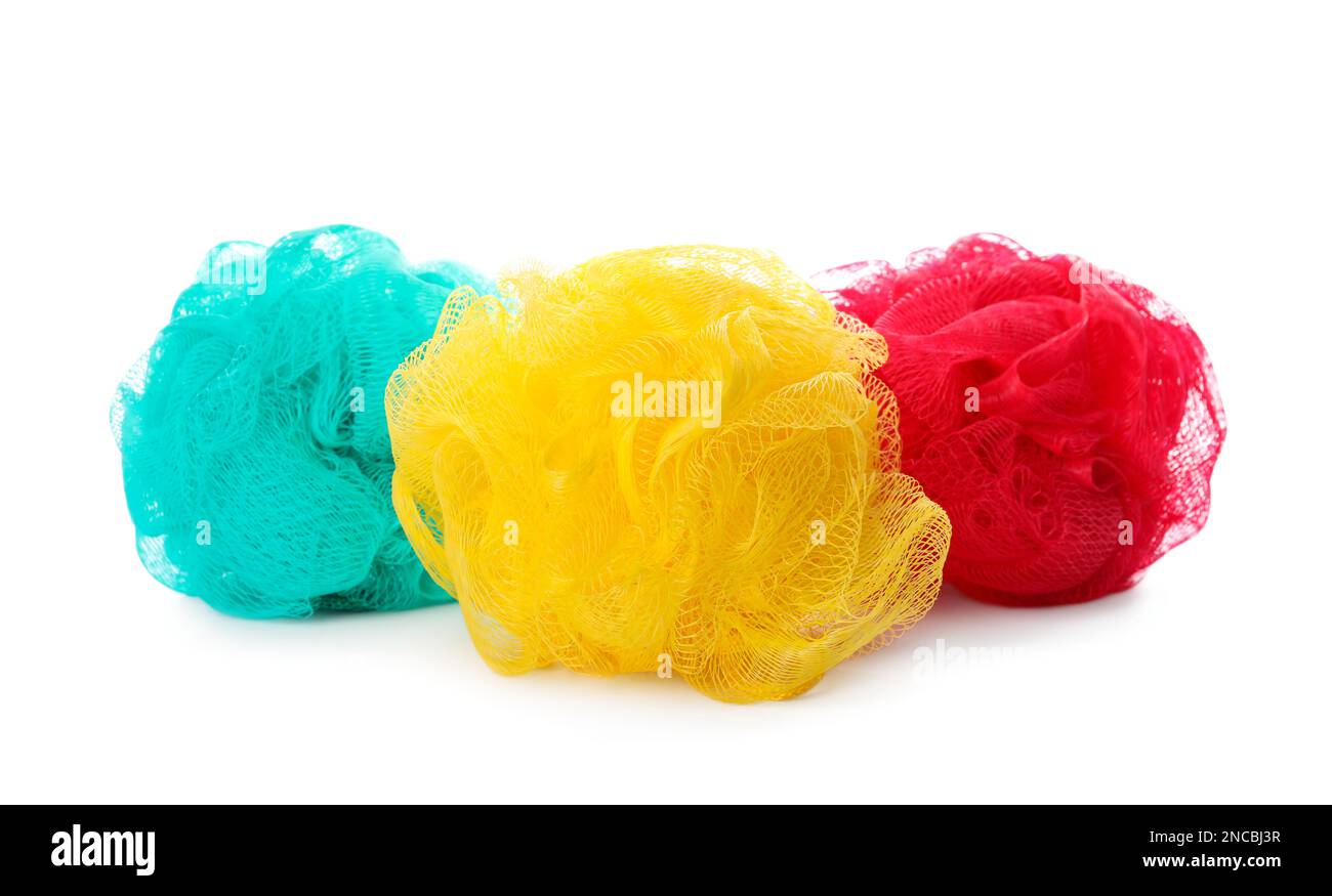 Set with new shower puffs on white background Stock Photo - Alamy