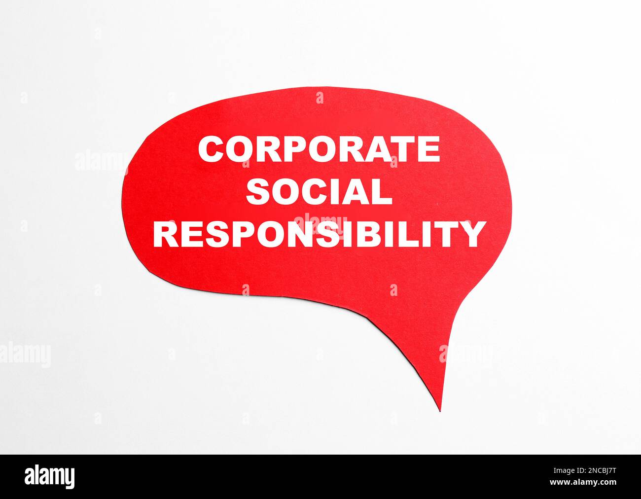 Red paper sheet with words Corporate Social responsibility on white ...