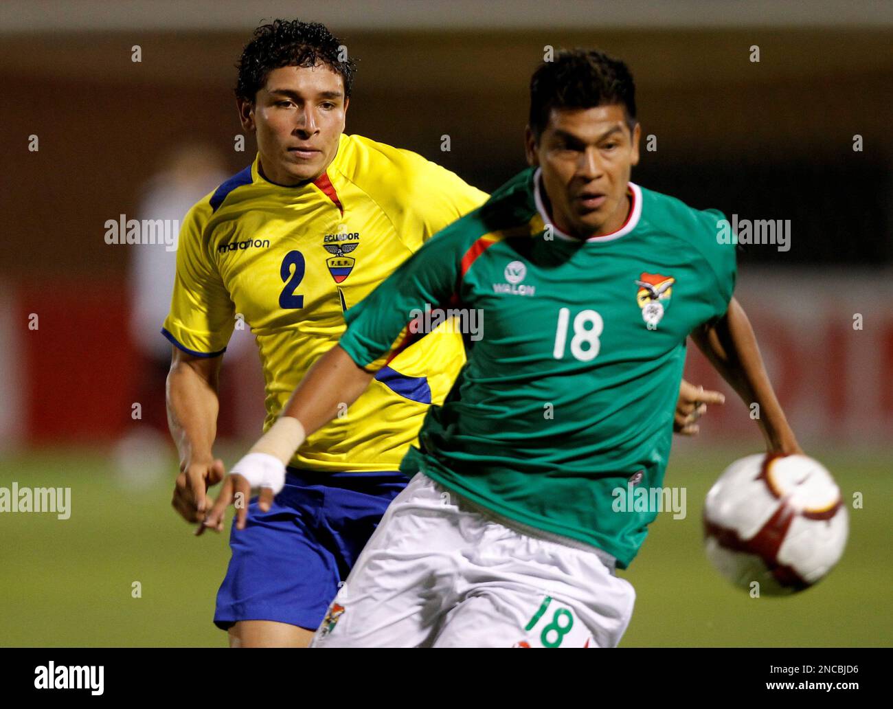 Ecuador's Mario Pineda, left, fights for the ball with Bolivia's Darwin ...