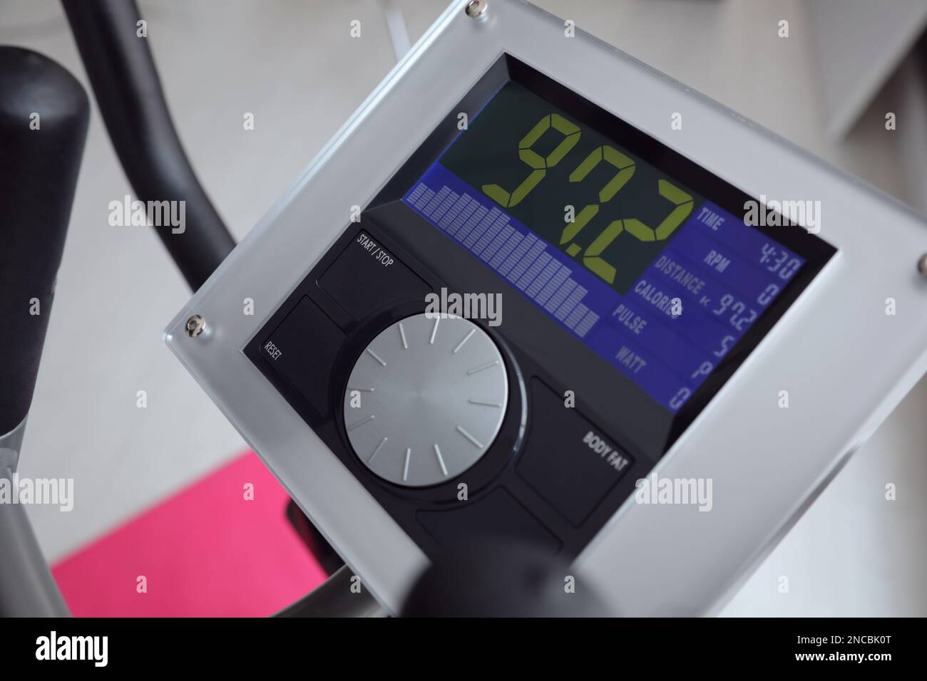 Control panel of modern elliptical machine cross trainer on blurred ...