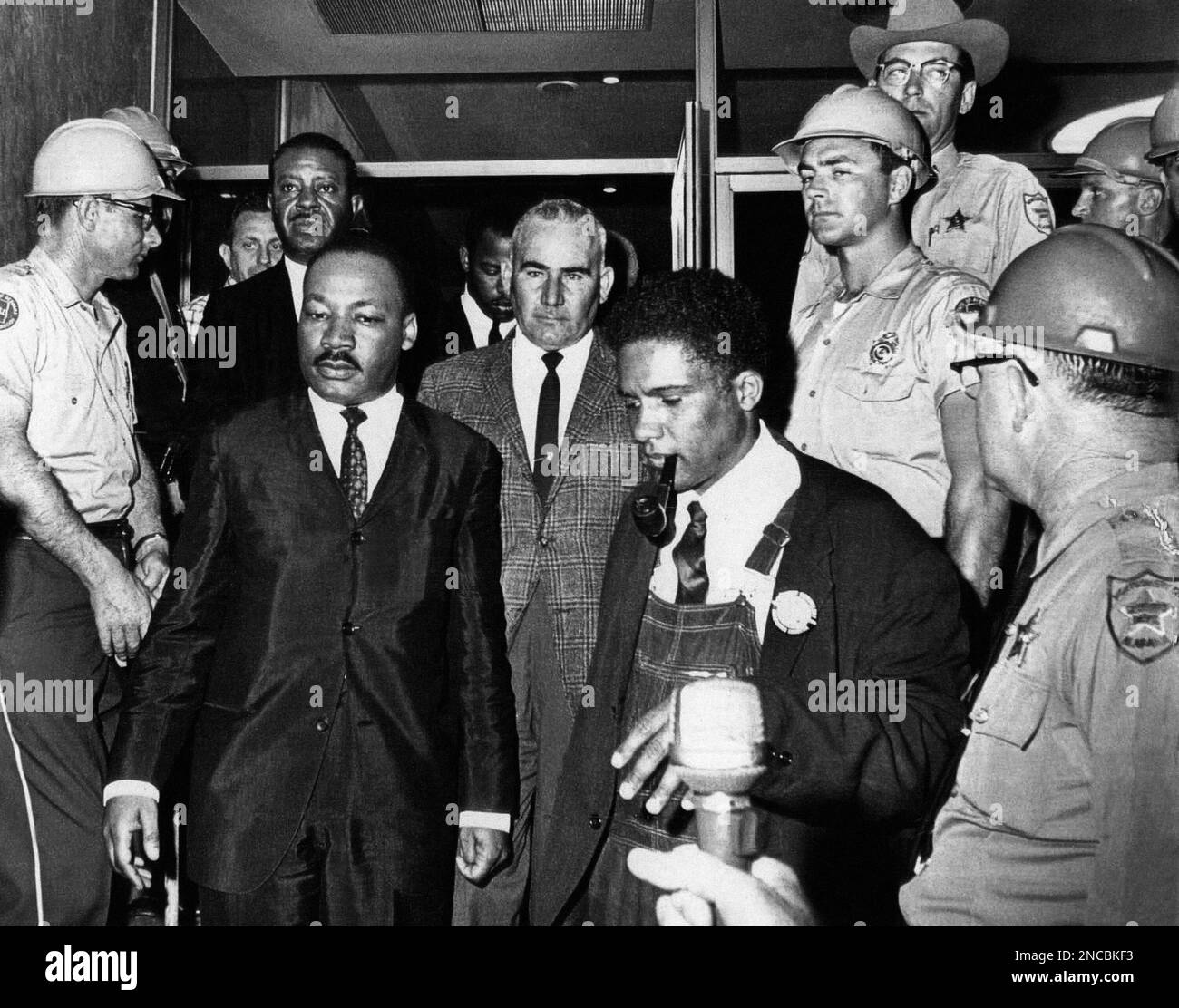 Dr. Martin Luther King Jr., second from left, is flanked by Sheriff Mac ...