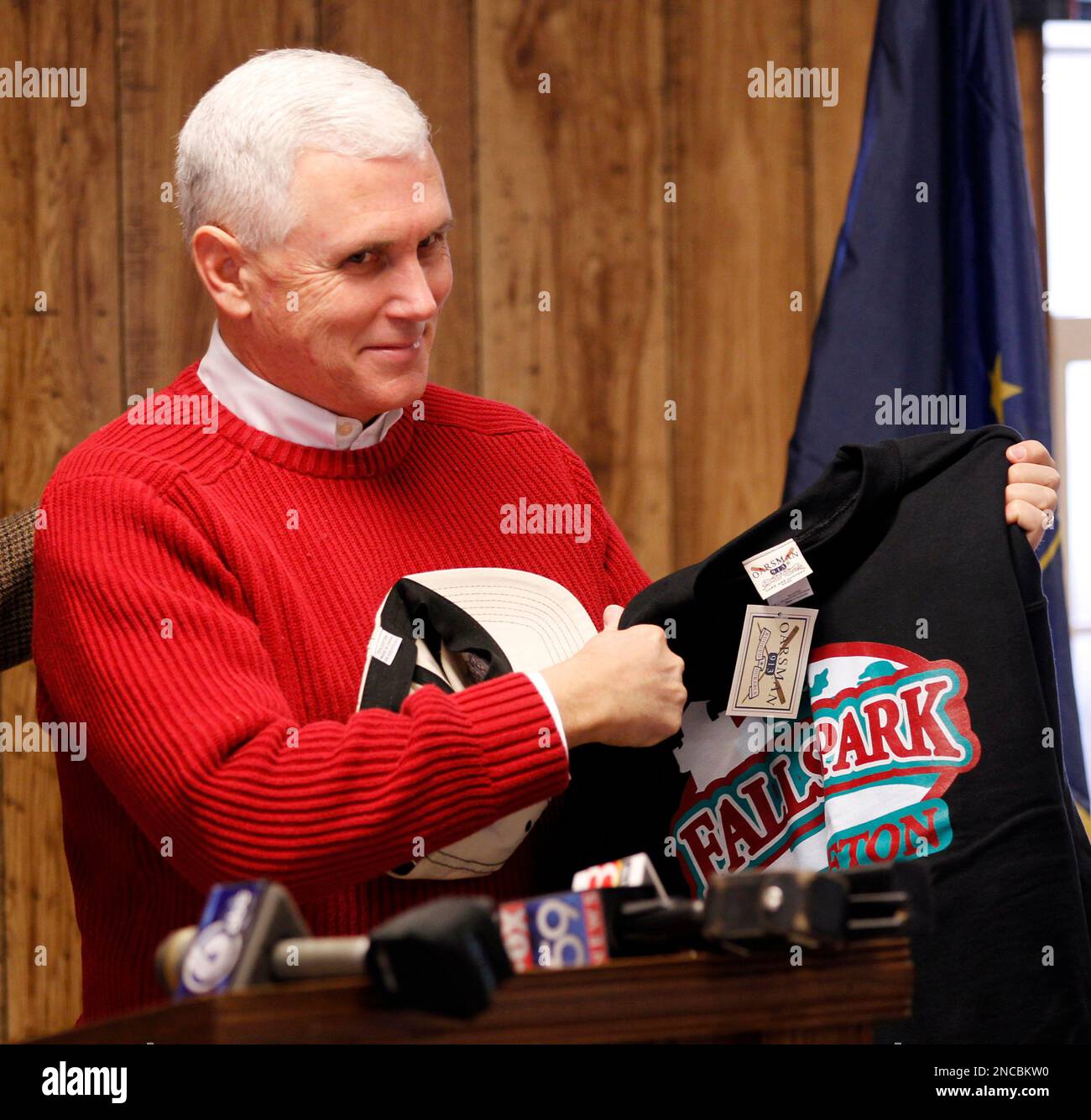 Rep. Mike Pence, R-Ind., smiles after he was given a shirt during a ...
