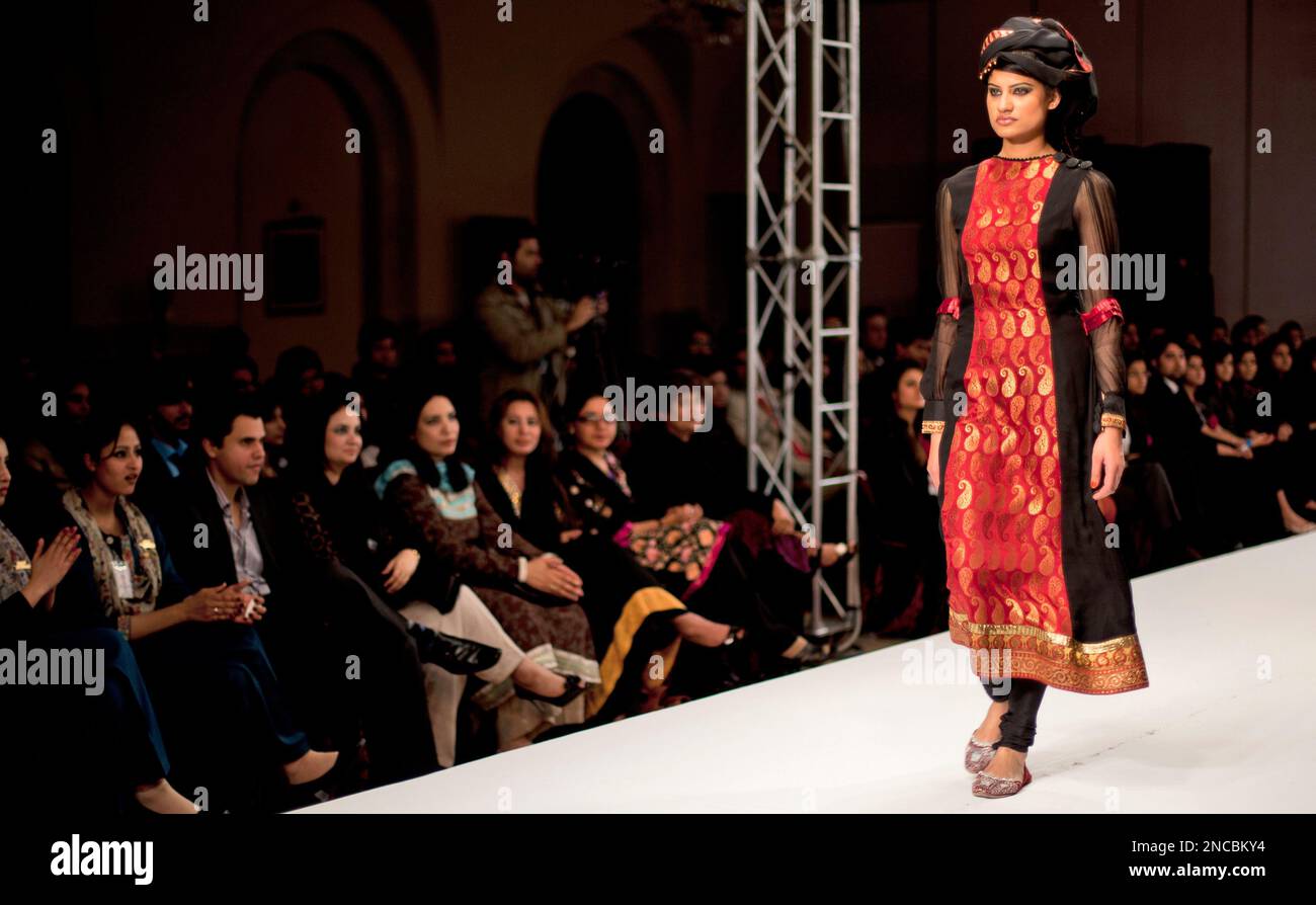A Pakistani Model displays a creation of Pakistani designers from a ...