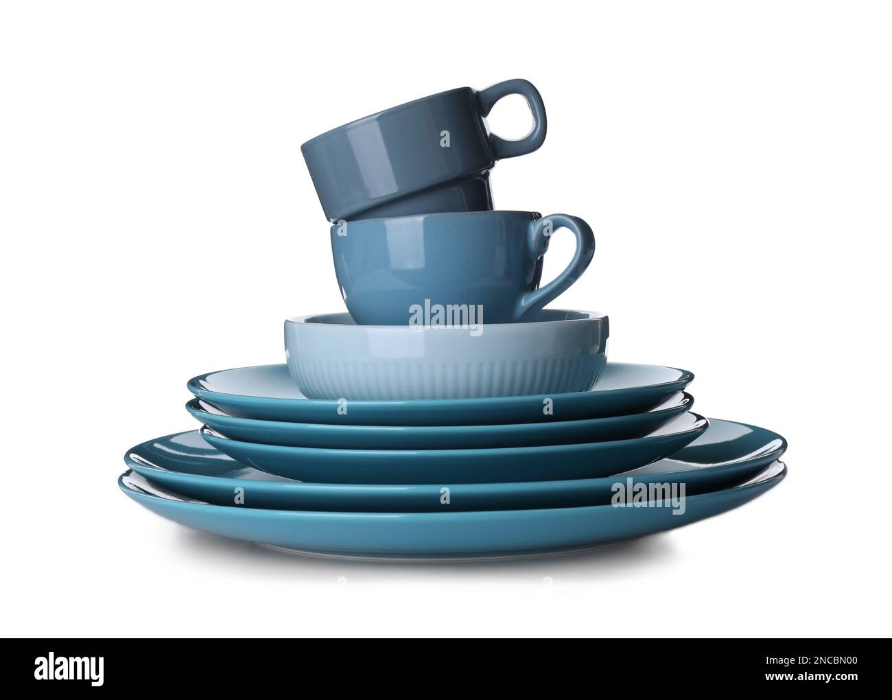 Stack of ceramic dishware on white background Stock Photo - Alamy