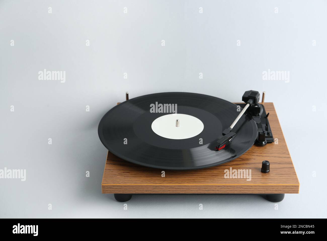 Turntable with vinyl record on light background. Space for text Stock ...