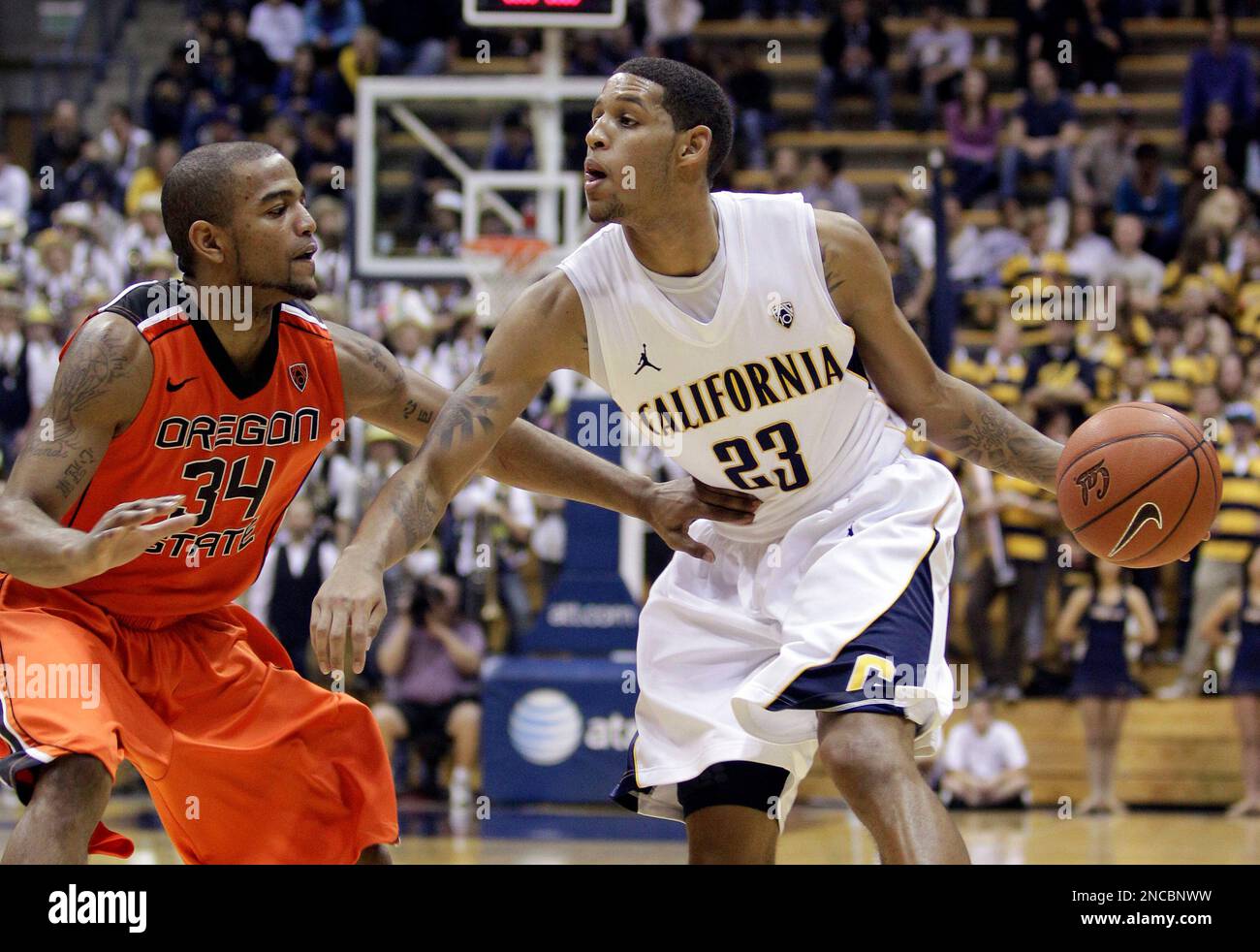 California's Allen Crabbe, right, drives the ball against Oregon State ...