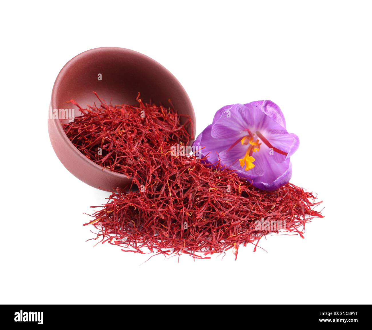 Dried saffron and crocus flower on white background Stock Photo - Alamy