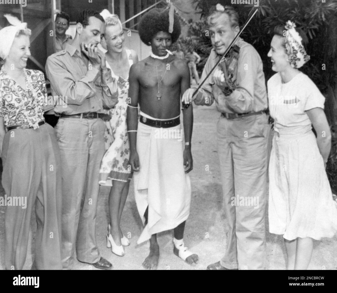 Jack Benny, radio and film comedian, touring with a group of ...