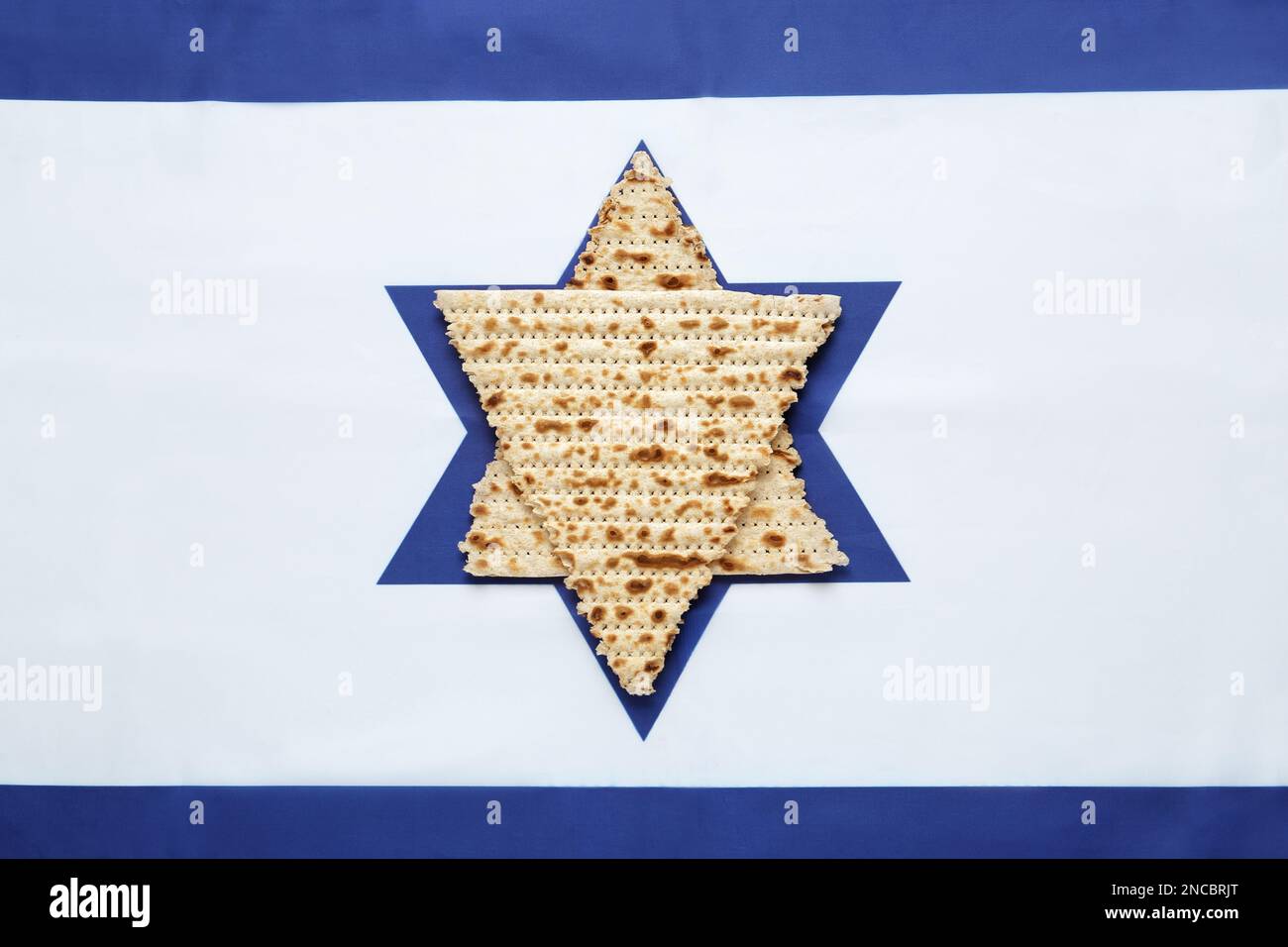 Star of David made with passover matzos on Israel flag, top view Stock ...