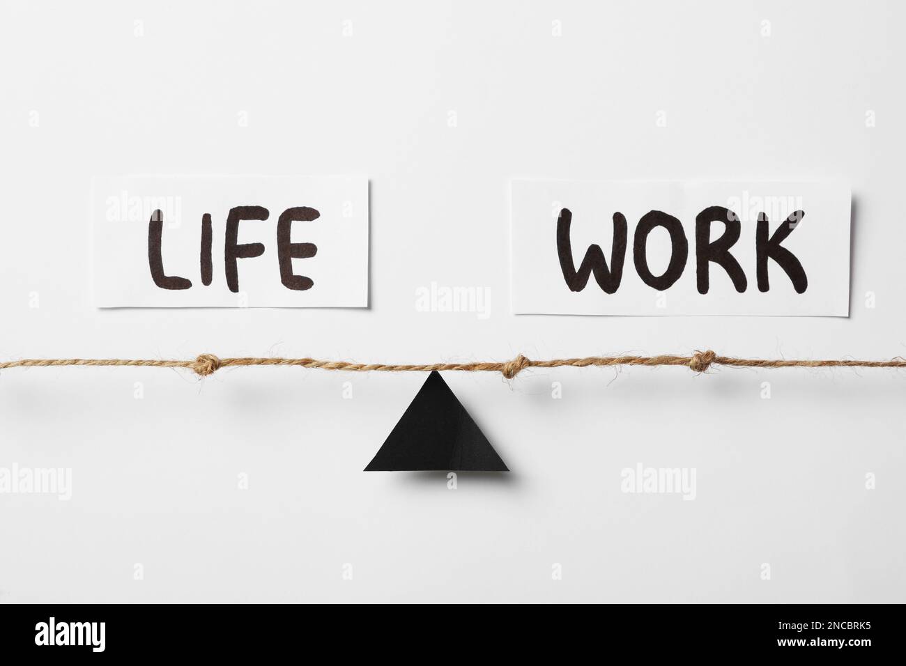 Black triangle, rope and words Life, Work on white background, flat lay ...