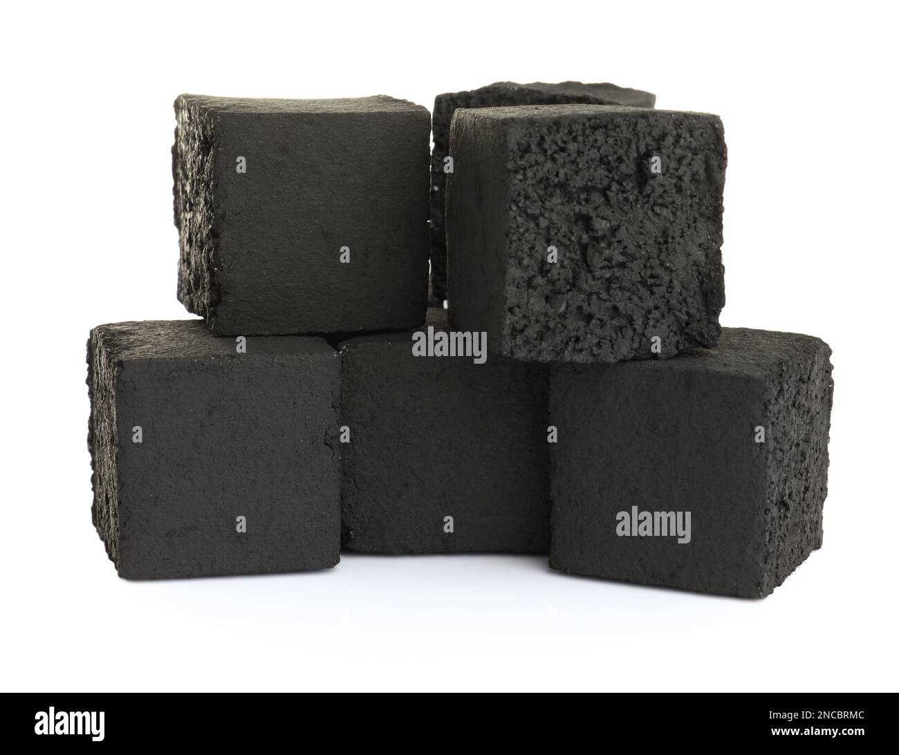 Stack of charcoal cubes for hookah on white background Stock Photo - Alamy