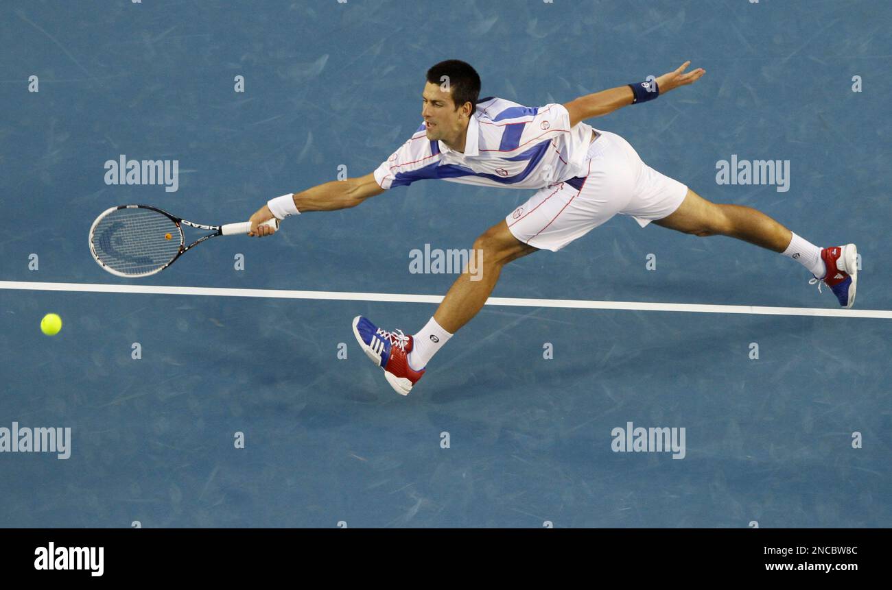 Serbia's Novak Djokovic stretches for a forehand return to Switzerland ...