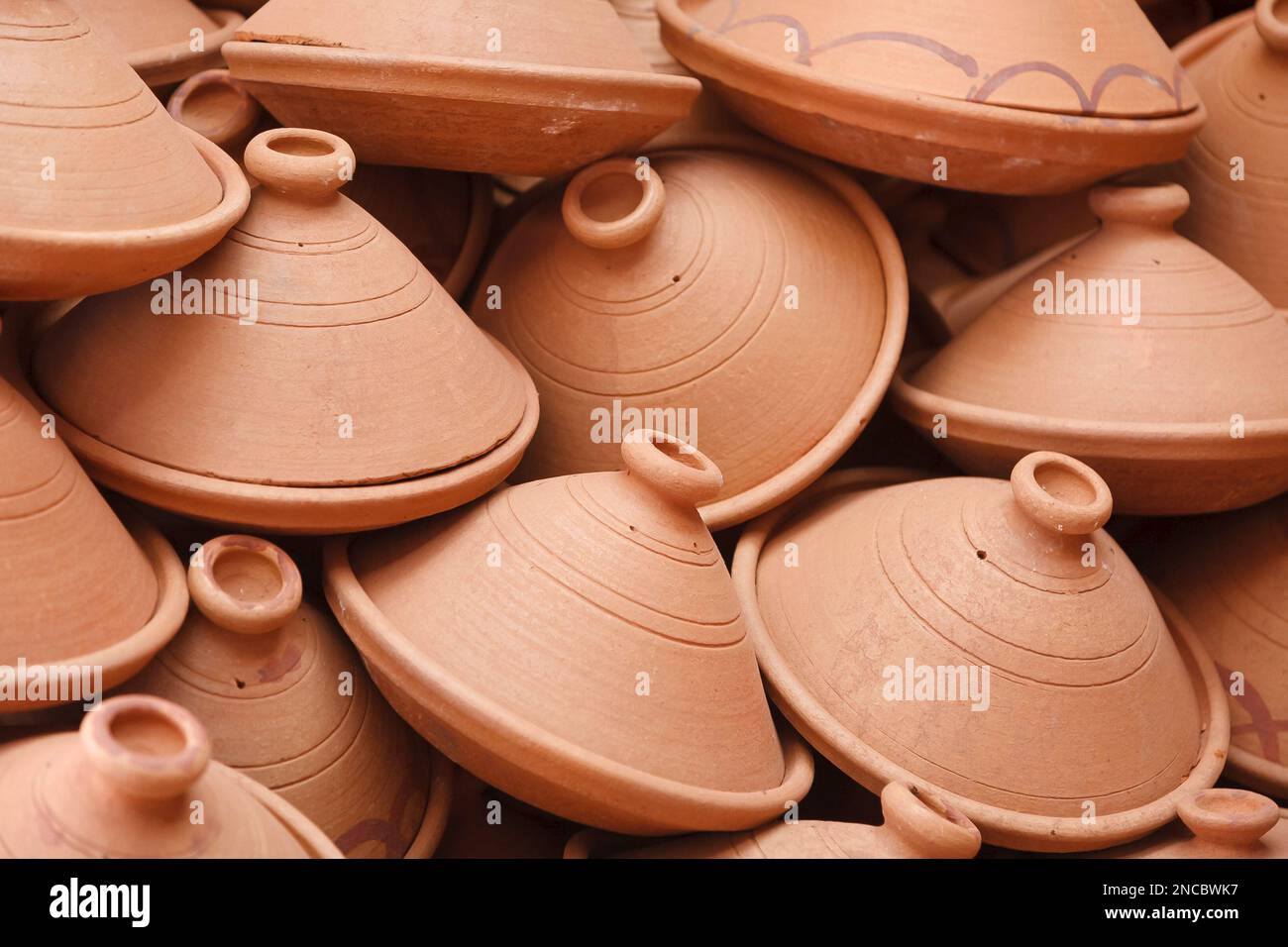 Stack of tagine ceramic cooking pots in a souk (market) in Marrakesh ...