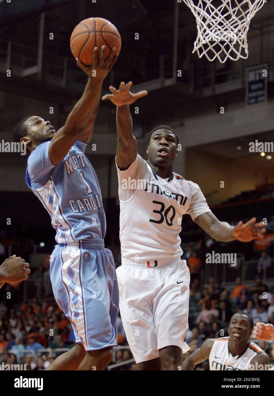 North Carolina's Dexter Strickland (1) shoots past Miami's Adrian ...