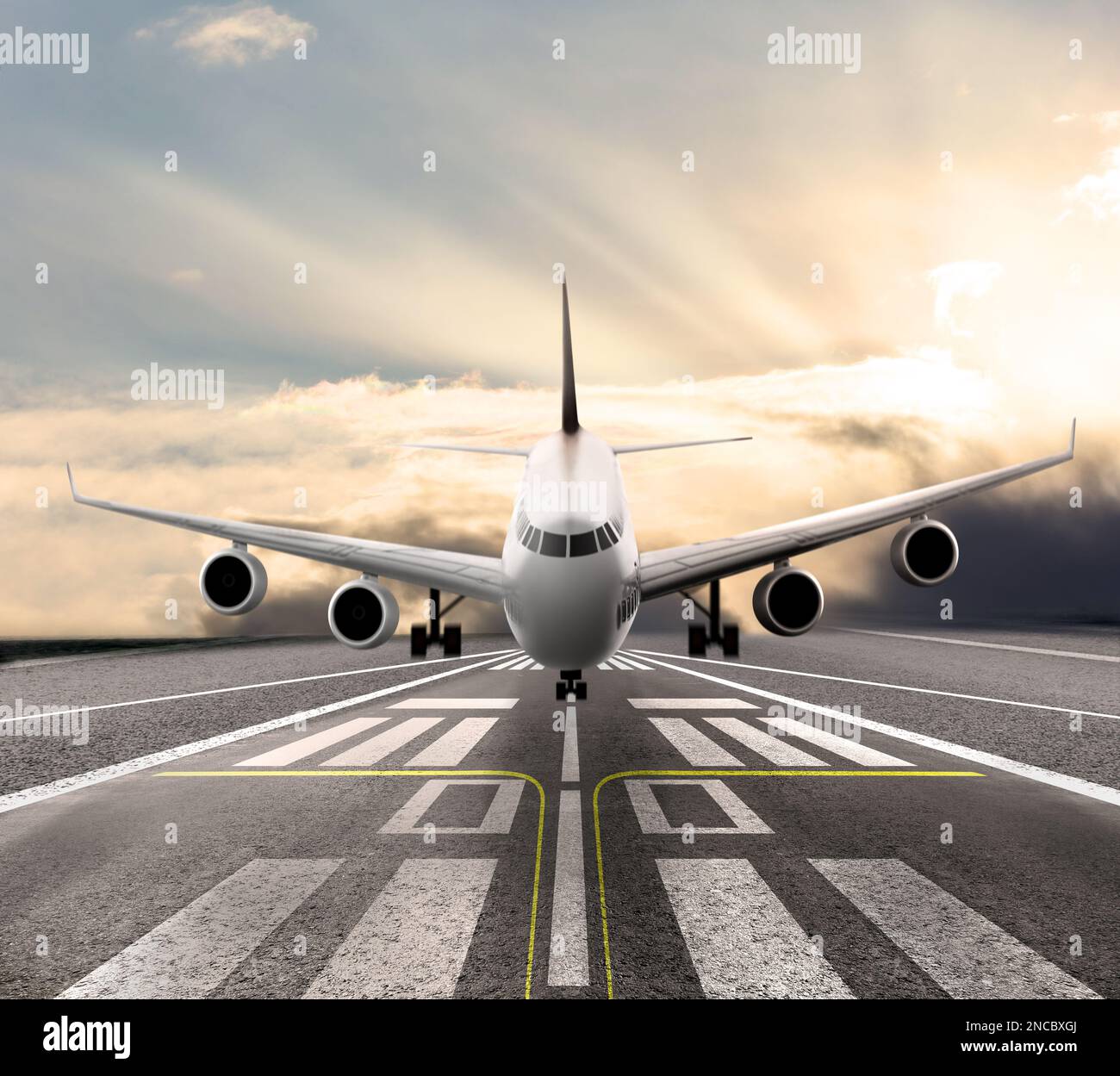 Modern white airplane landing on runway Stock Photo - Alamy