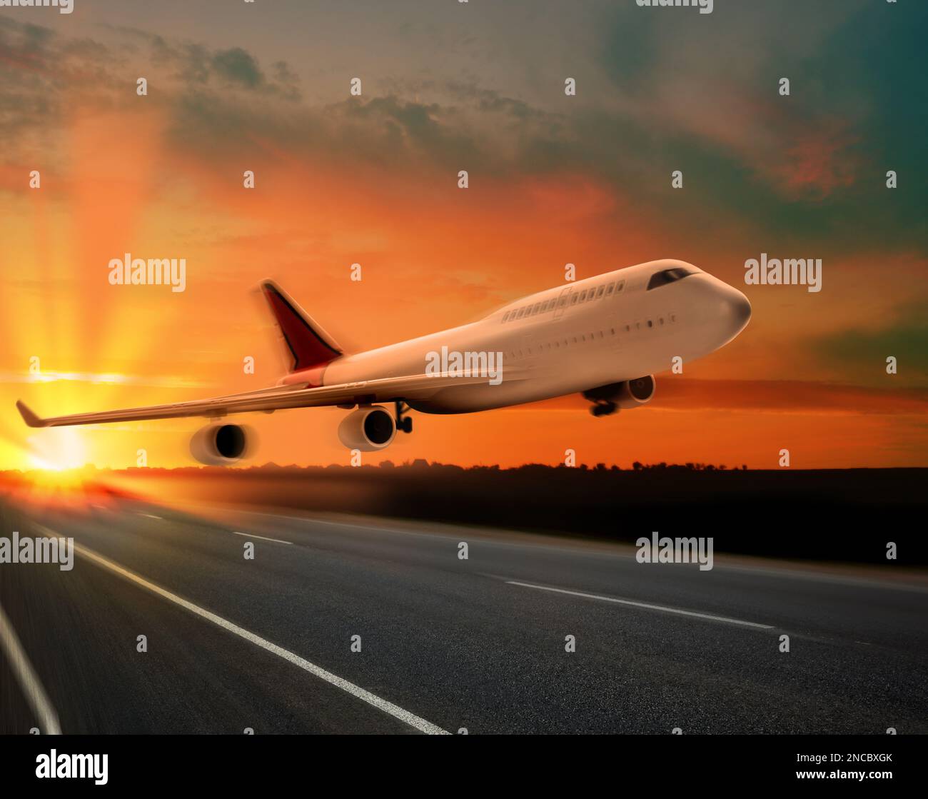 Modern white airplane landing on runway Stock Photo - Alamy
