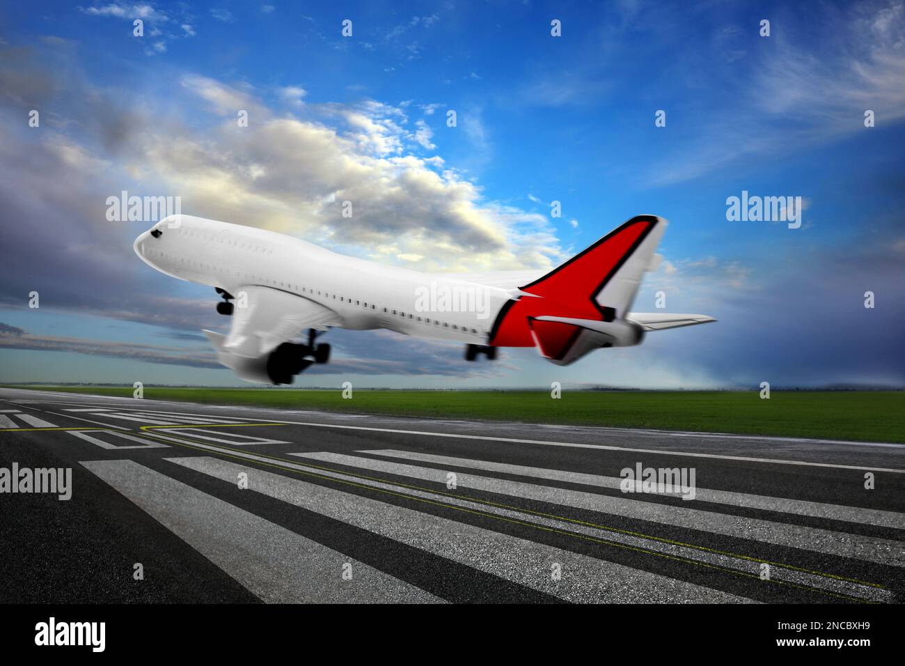 Modern white airplane landing on runway Stock Photo - Alamy