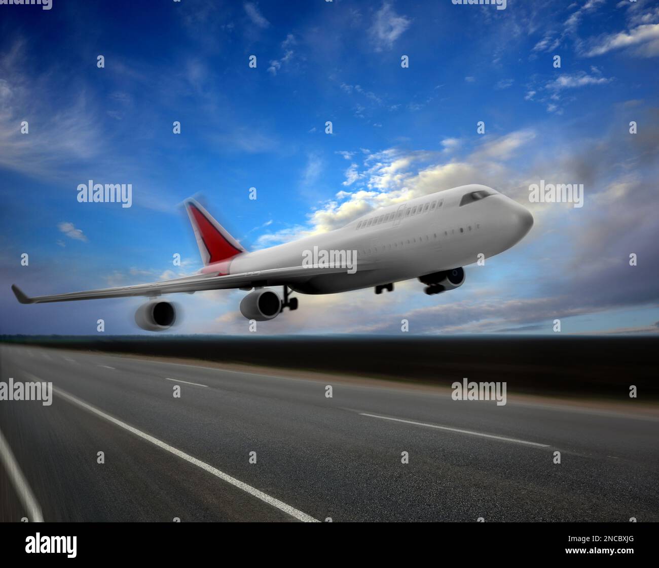 Modern white airplane landing on runway Stock Photo - Alamy