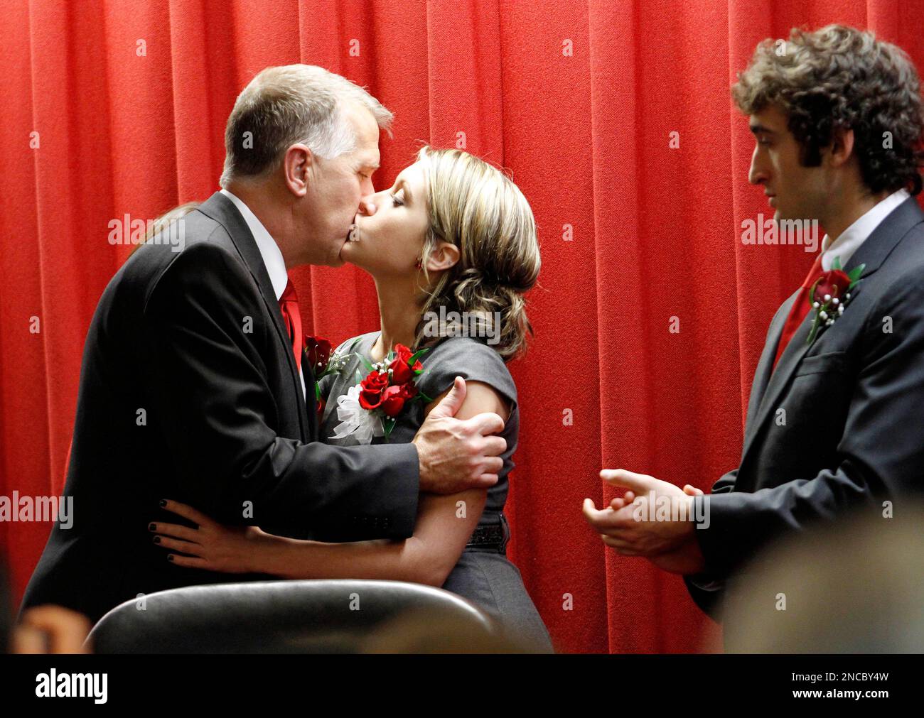 House of Representives Thom Tillis, R-Mecklenburg County, right, kisses ...
