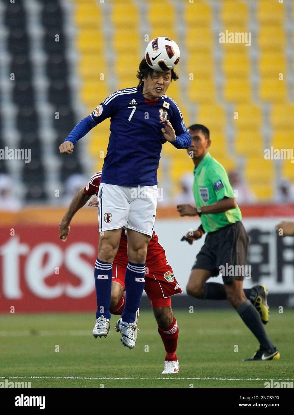 Japan's player Yasuhito Endo is seen heading a ball while playing ...