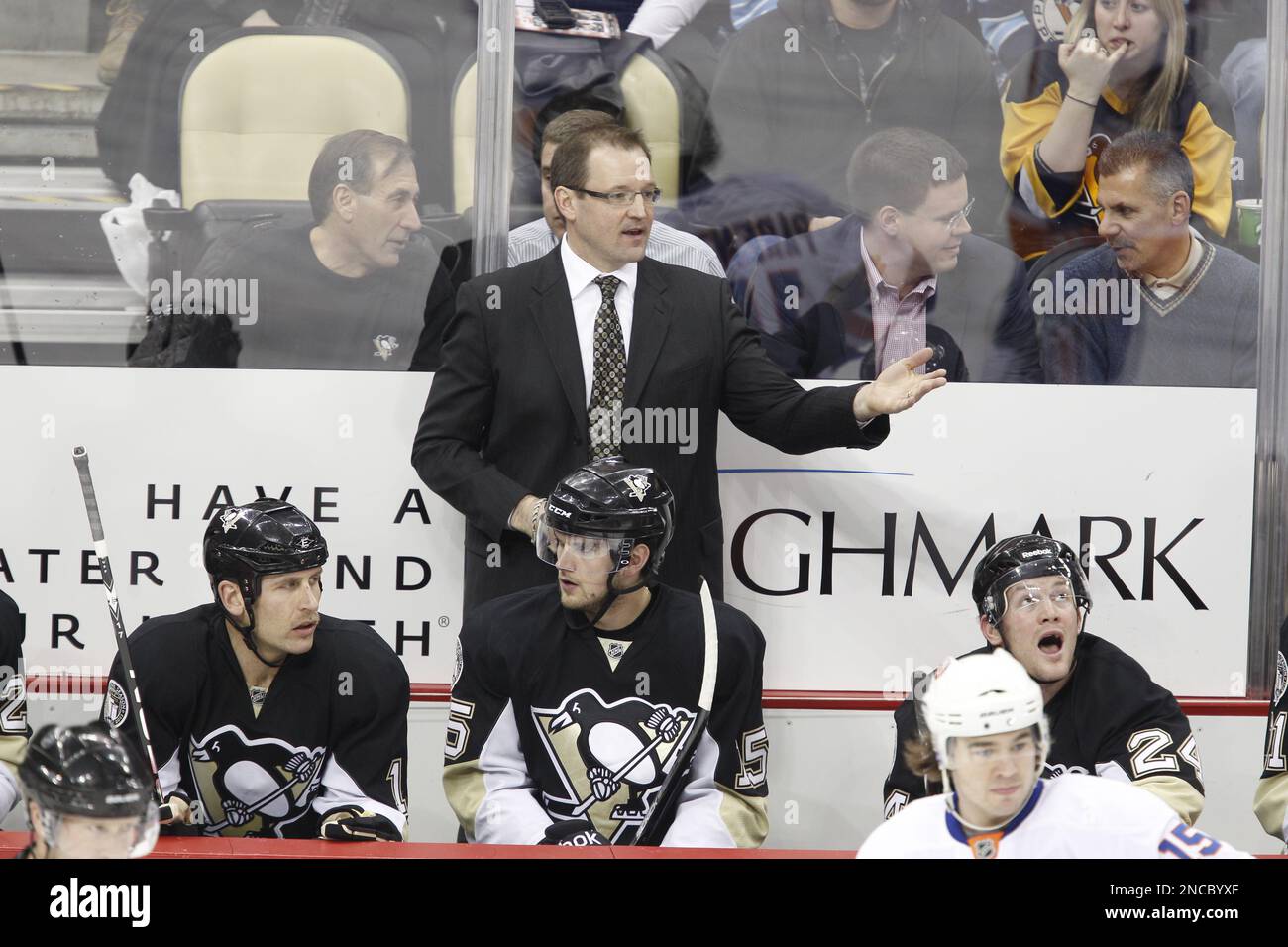 Pittsburgh Penguins head coach Dan Bylsma stands behind his bench ...