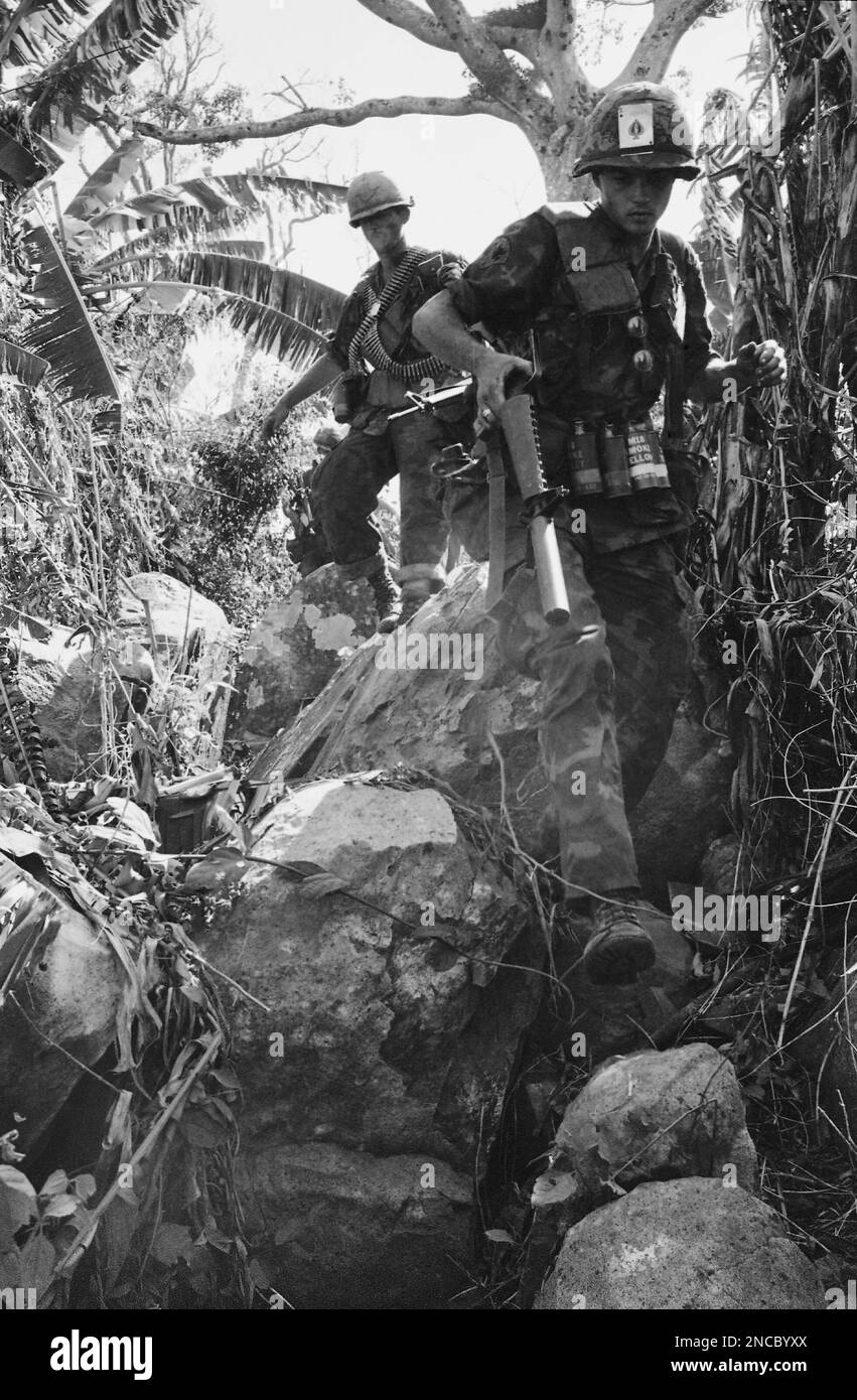 While other Marines hug the ground machine gunners rush forward their ...